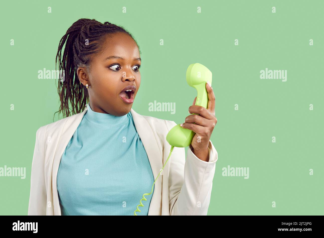 Woman gets shocking news over phone and looks at receiver with ...