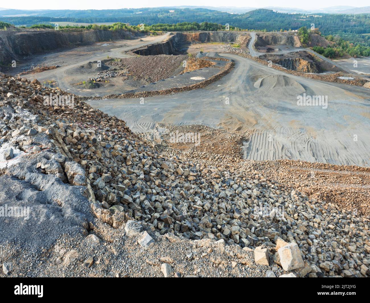 Basalt quarry. Marks of excavator operating in a rock quarry.The ...