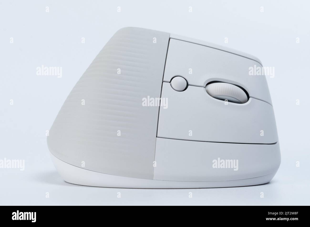 Modern ergonomic mouse with scroll button isolated on studio background ...