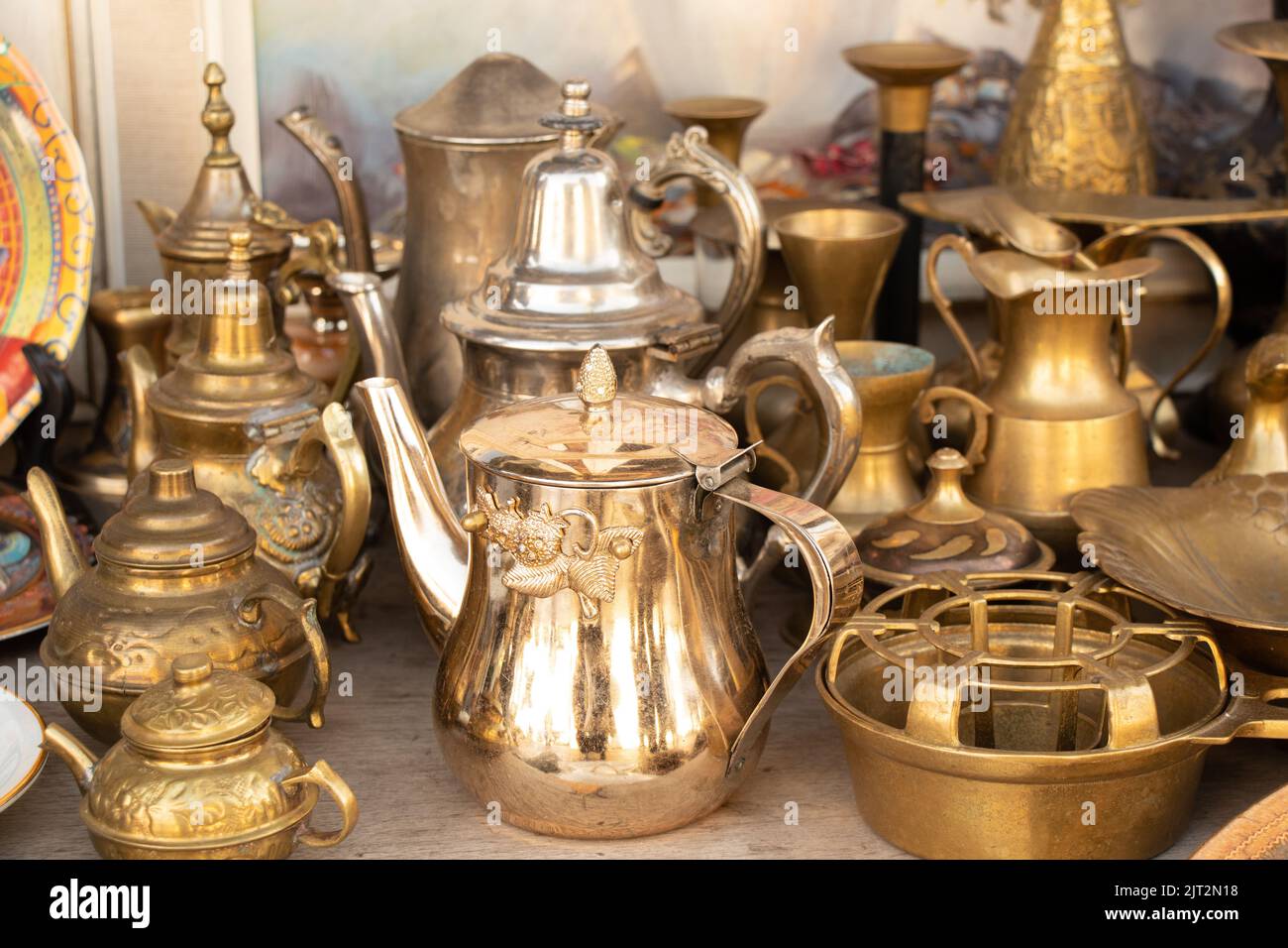 Copper antique jugs on the shelves, a collection of antique copper ...