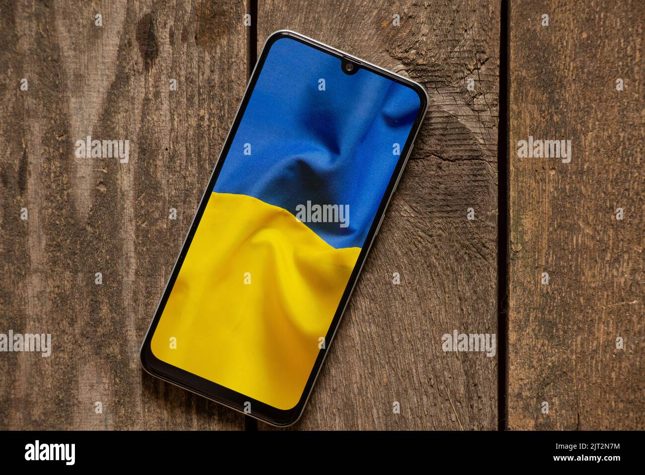 The national flag of Ukraine as a background on the phone, peace in ...