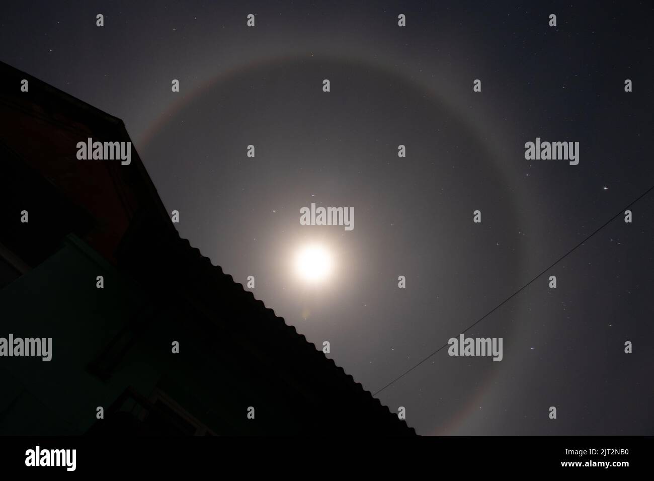 Halo phenomenon on the moon over Ukraine at night during the war in the ...