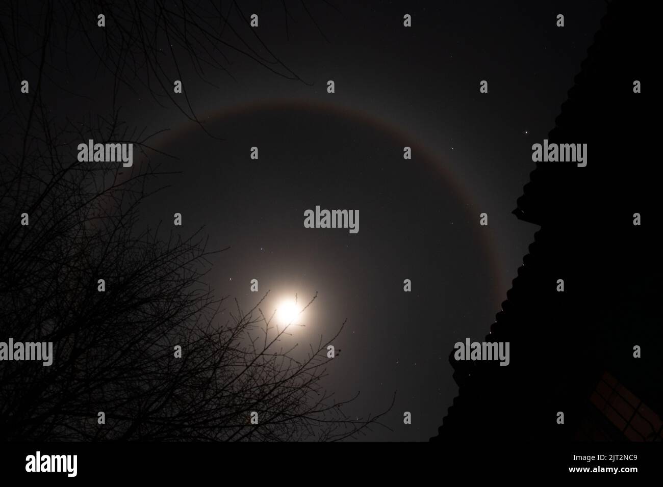 Halo phenomenon on the moon over Ukraine at night during the war in the ...