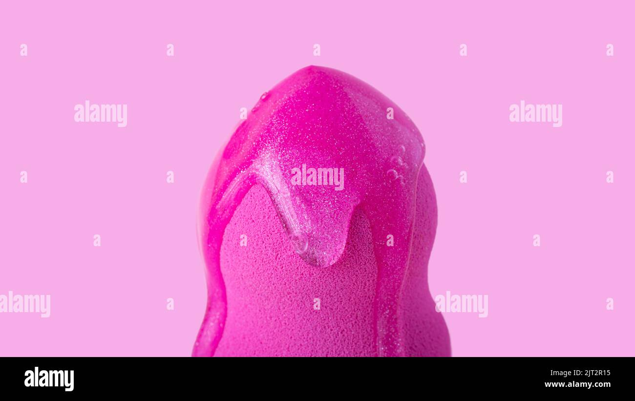 Closeup photography of beauty blender with dripping cosmetic gel on it ...