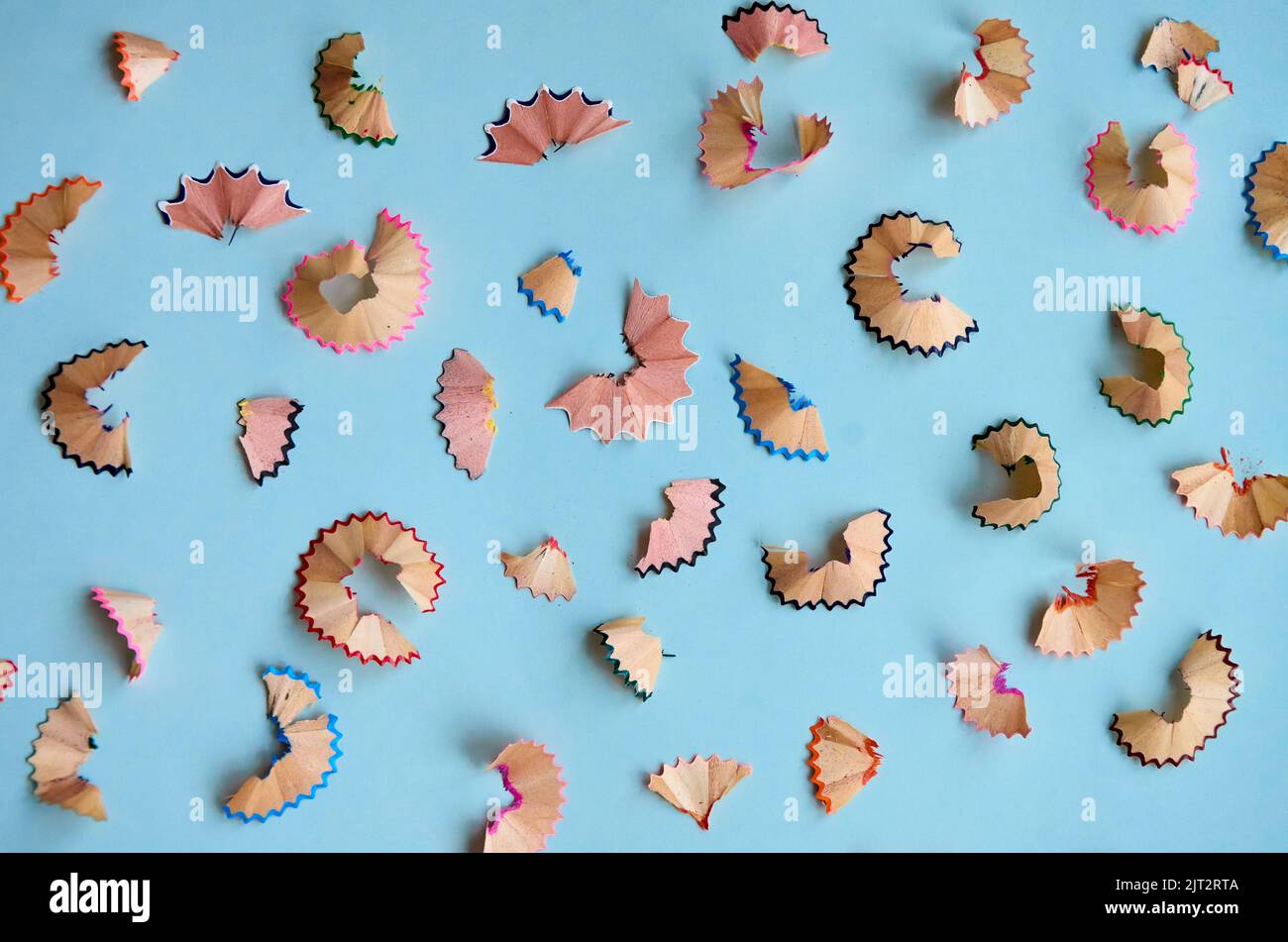 Many color pencils peels pattern isolated on white background, flatlay ...