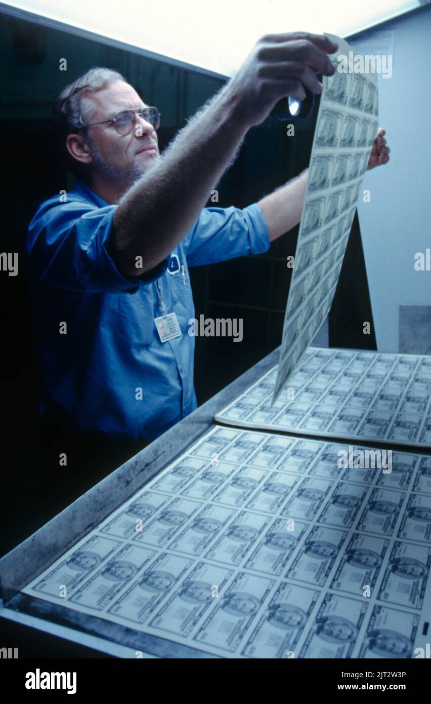 An engraver at the United State Bureau of Engraving proofs the new ...