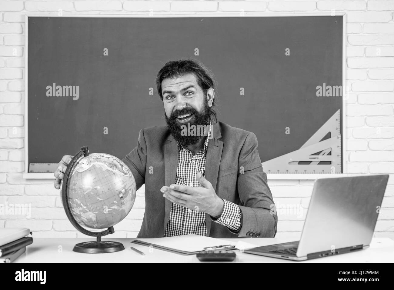 Teacher Studying geography At Desks In Classroom with globe, world map ...