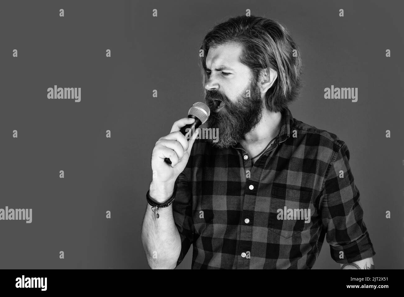 Music is the universal language of mankind. bearded man in checkered ...