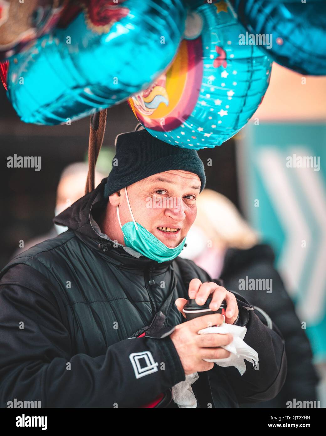 Man with balloons city hi-res stock photography and images - Alamy