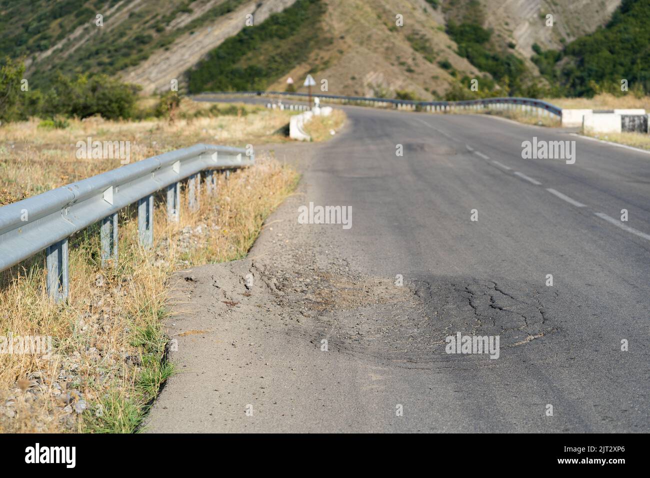 Deformed asphalt surface of road caused by melting of material due to ...