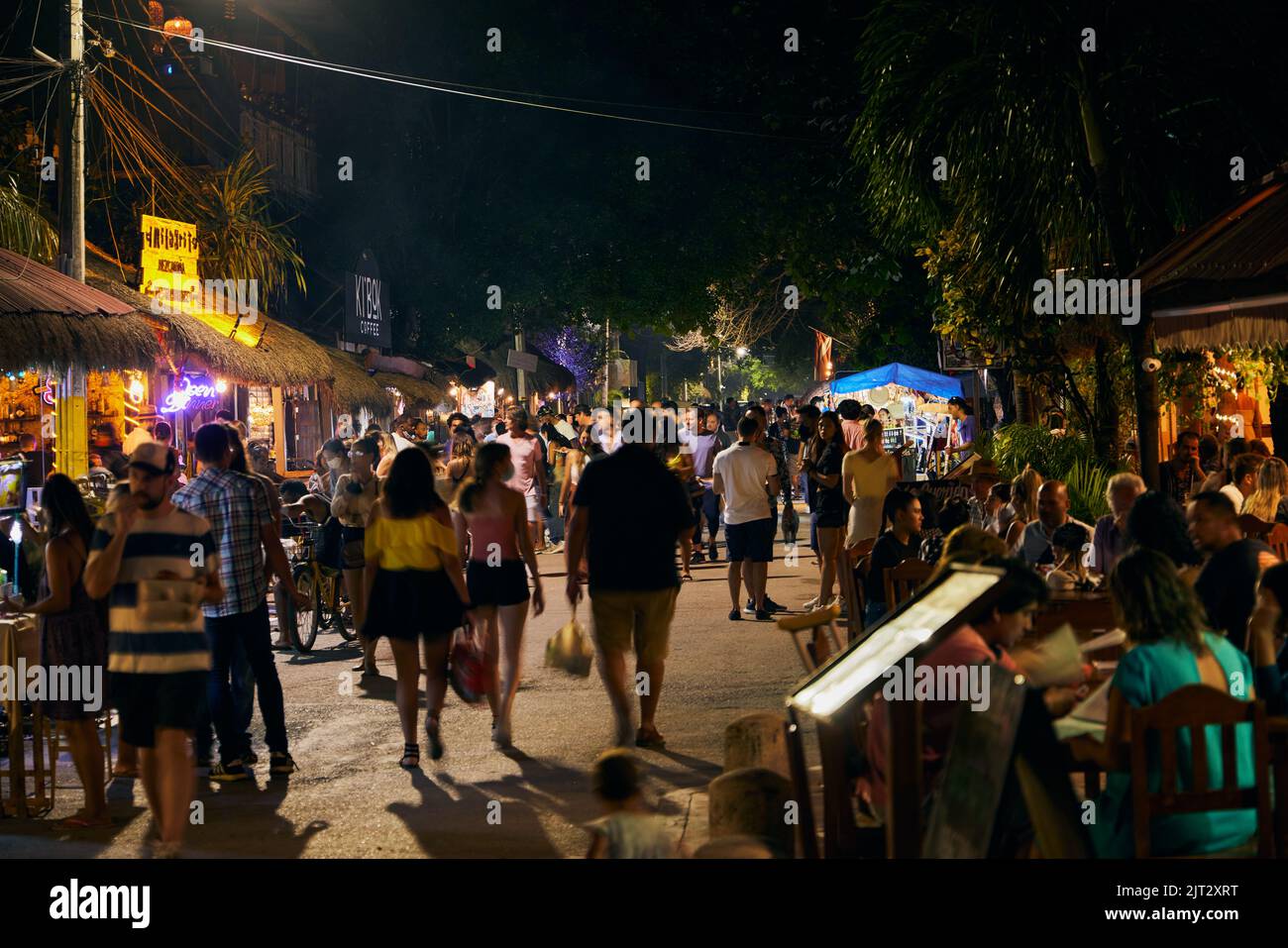 The streets of Tulum at night with a huge crowd of people in Quintana ...