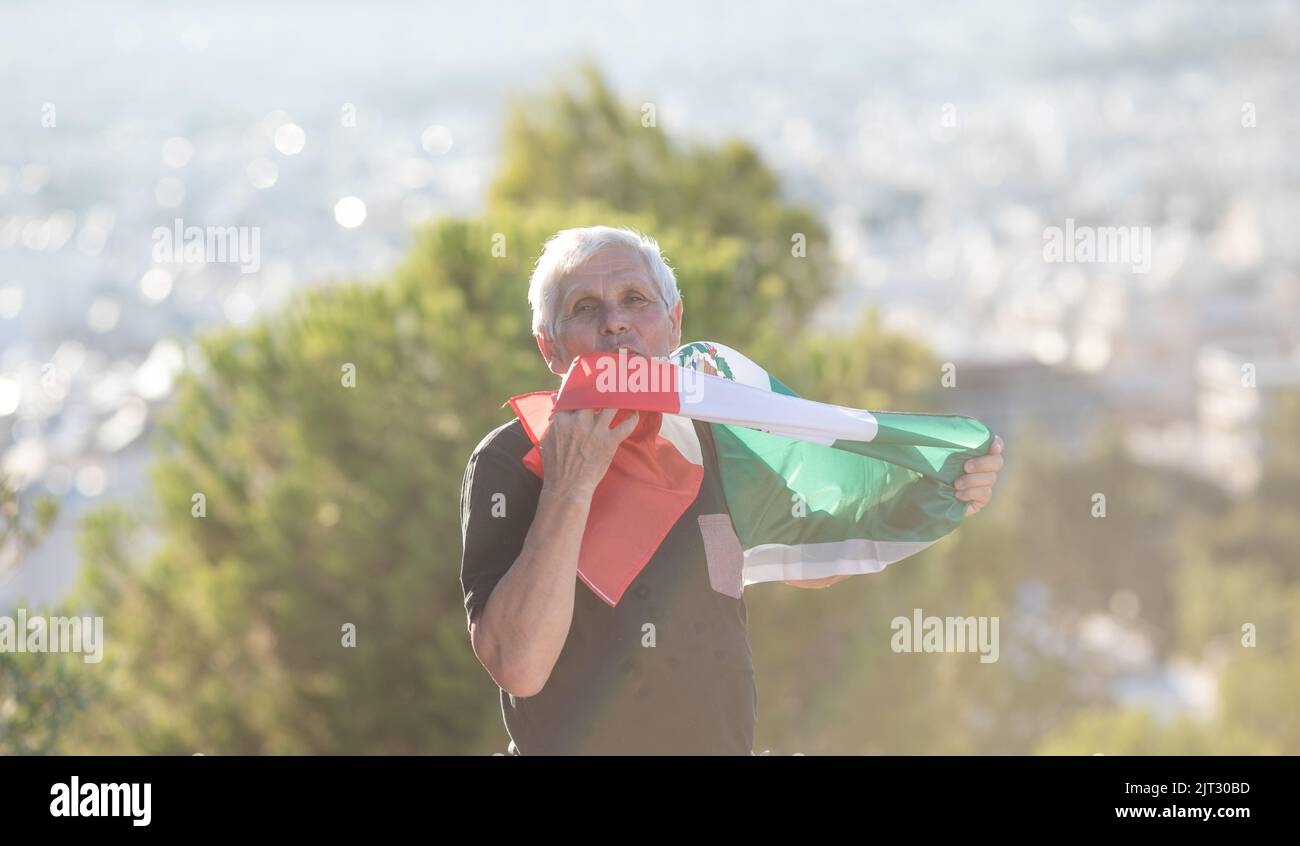 Senior man holding flag of Mexico. "September 16. Independence Day of ...