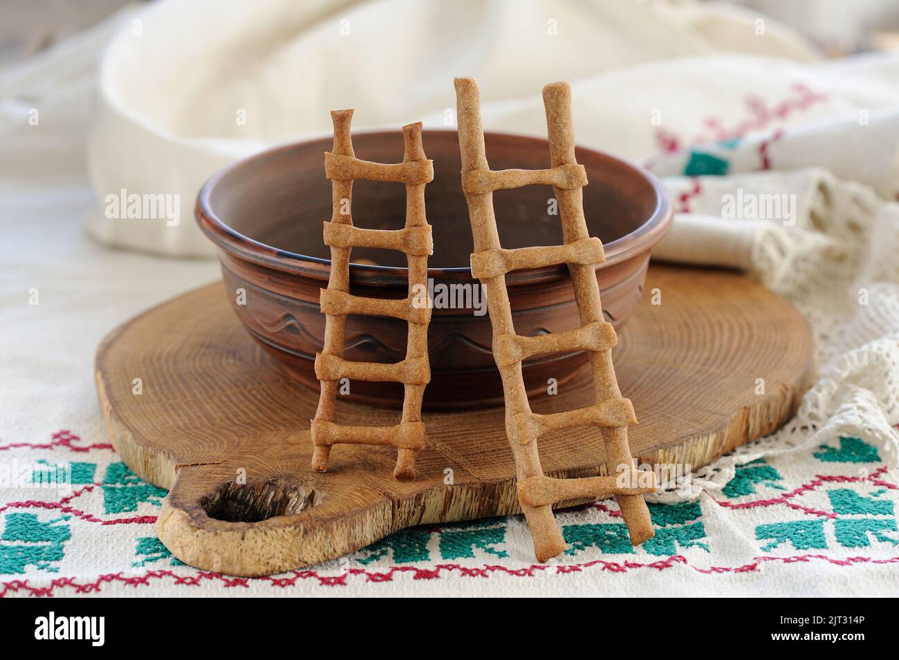 Lestvitsi, Russian rye festive spring cookies, clay bowl and rushnik ...