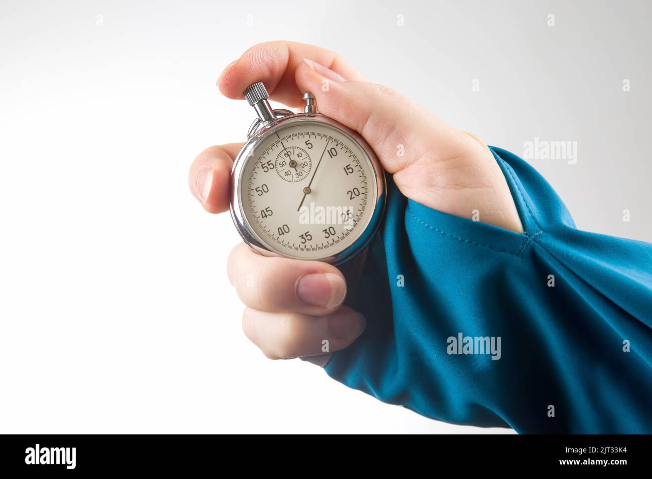 hand with a mechanical stopwatch on a white background Stock Photo - Alamy