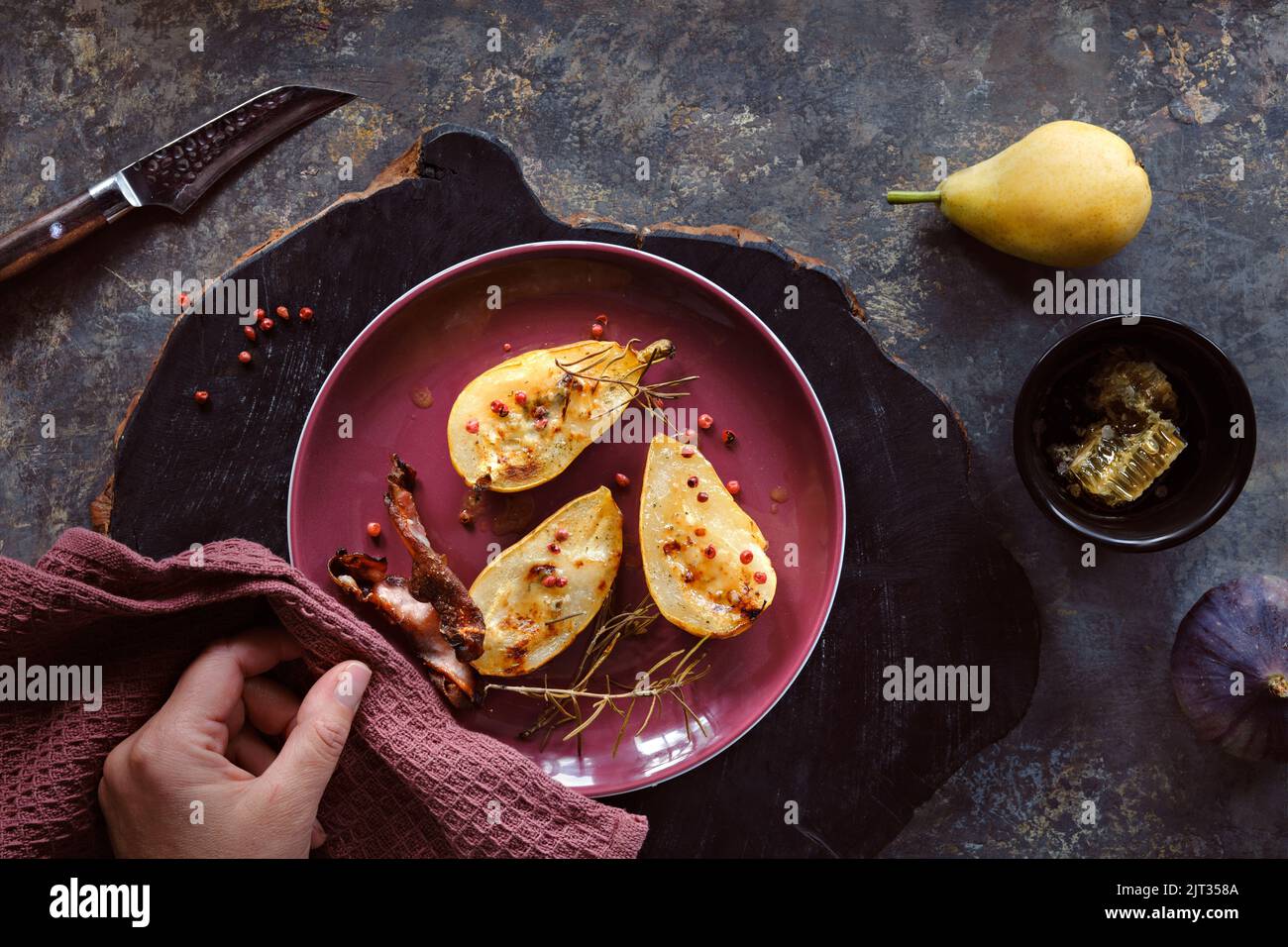 Baked pears with honey and red pepper. Flat lay, top view with fresh ...