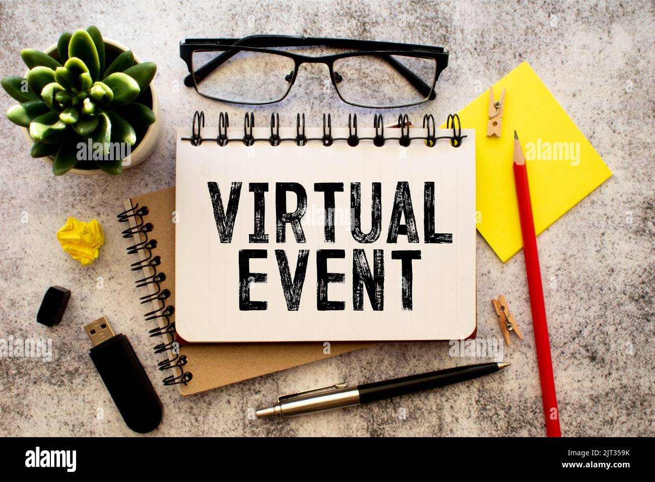 VIRTUAL EVENT. text on sticker on bright green background. near paper ...