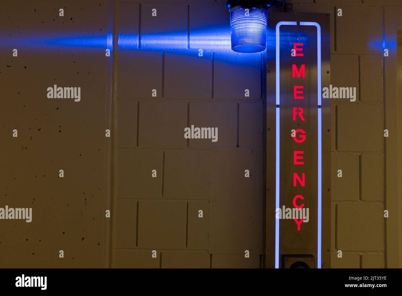 Illuminated Emergency Sign in Parking Garage Stock Photo - Alamy