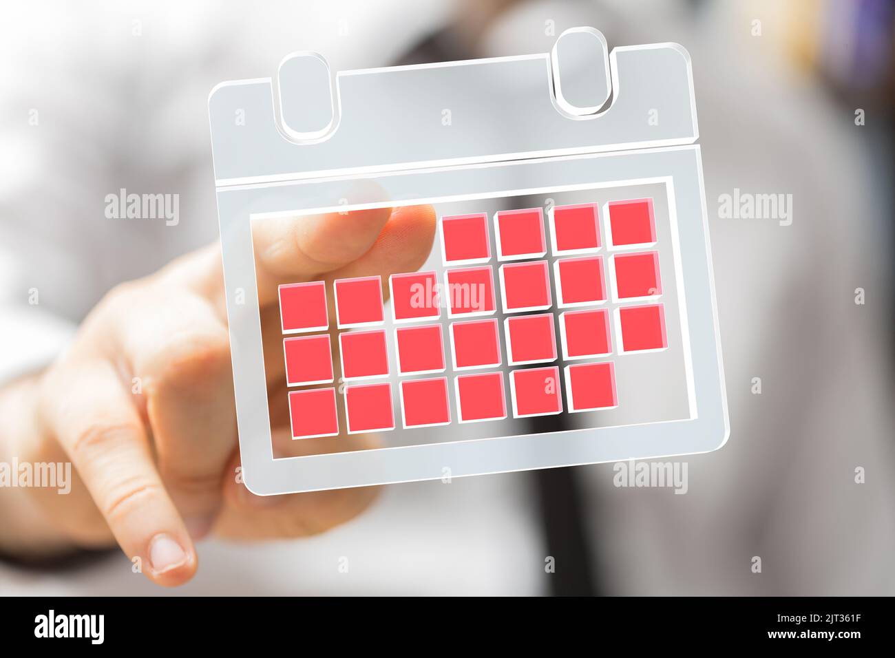 A human hand touching a calendar icon with a blurred background Stock ...