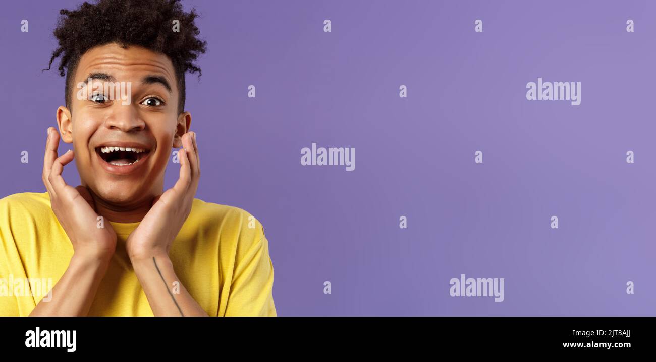 Close-up portrait of extremely happy, enthusiastic young man hear ...