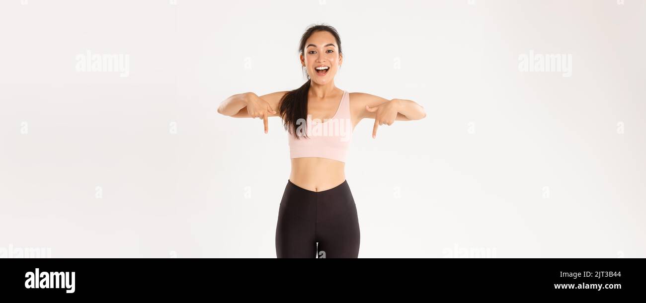 Sport, wellbeing and active lifestyle concept. Smiling energized asian ...