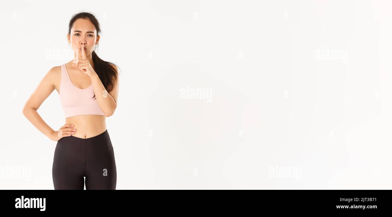 Sport, wellbeing and active lifestyle concept. Serious asian female gym ...