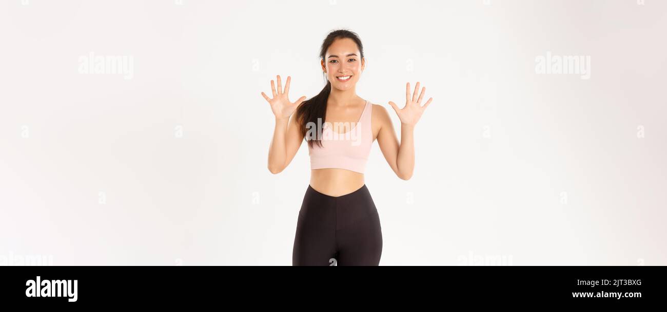 Sport, wellbeing and active lifestyle concept. Smiling strong and slim ...