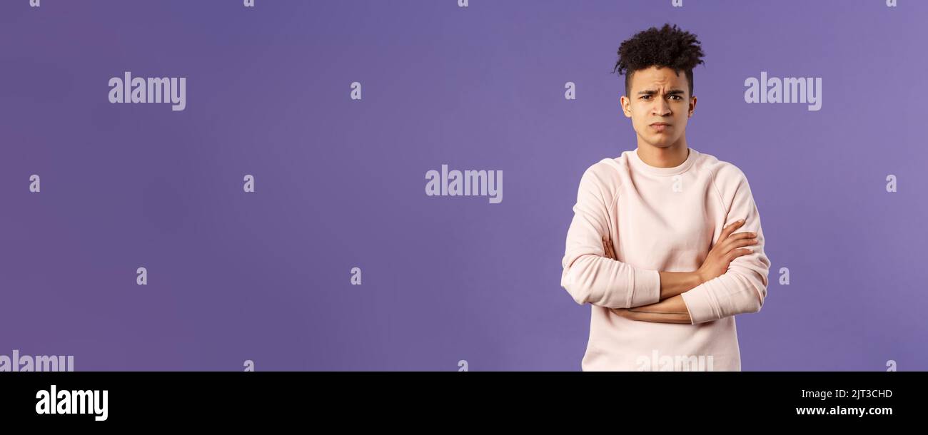 Portrait of young offended hispanic boyfriend, frowning and looking ...