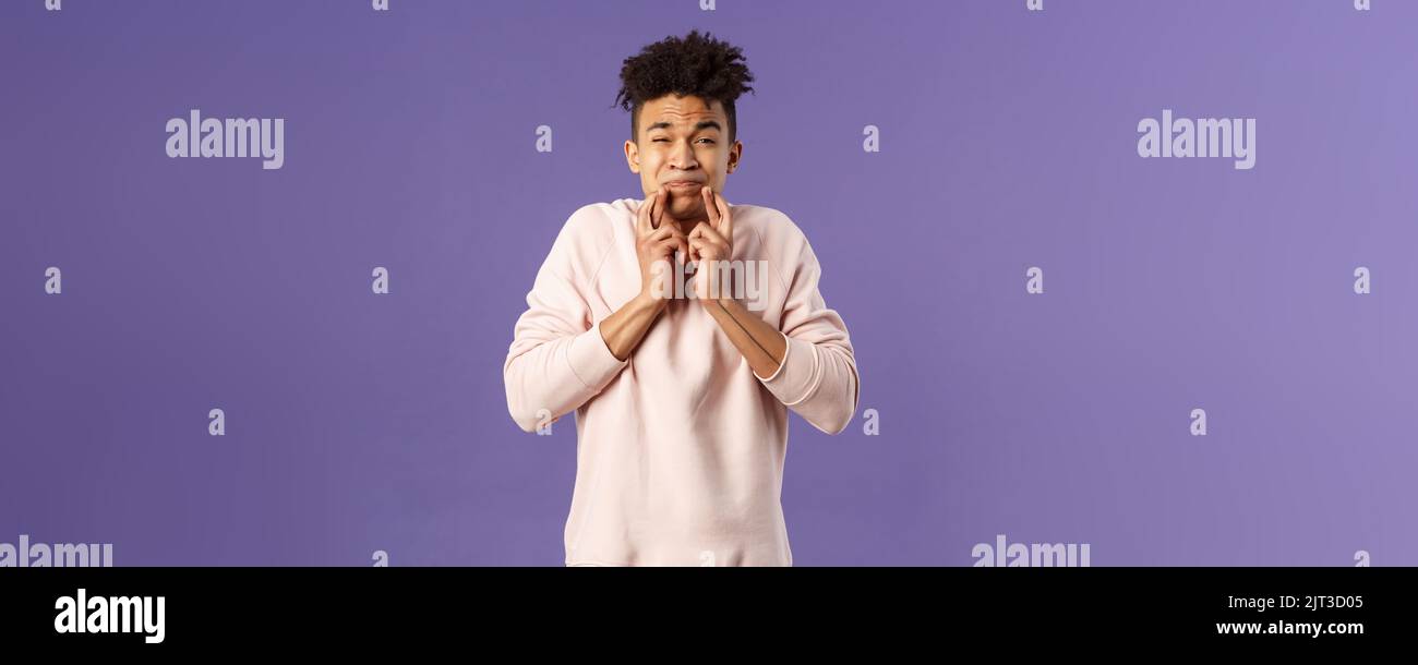 Purple of young intense and worried male student badly want dream to ...