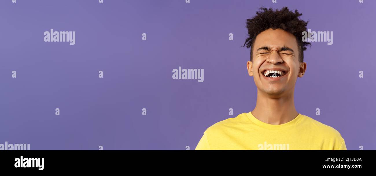 Close-up portrait of happy carefree young guy laughing loud, chuckling ...