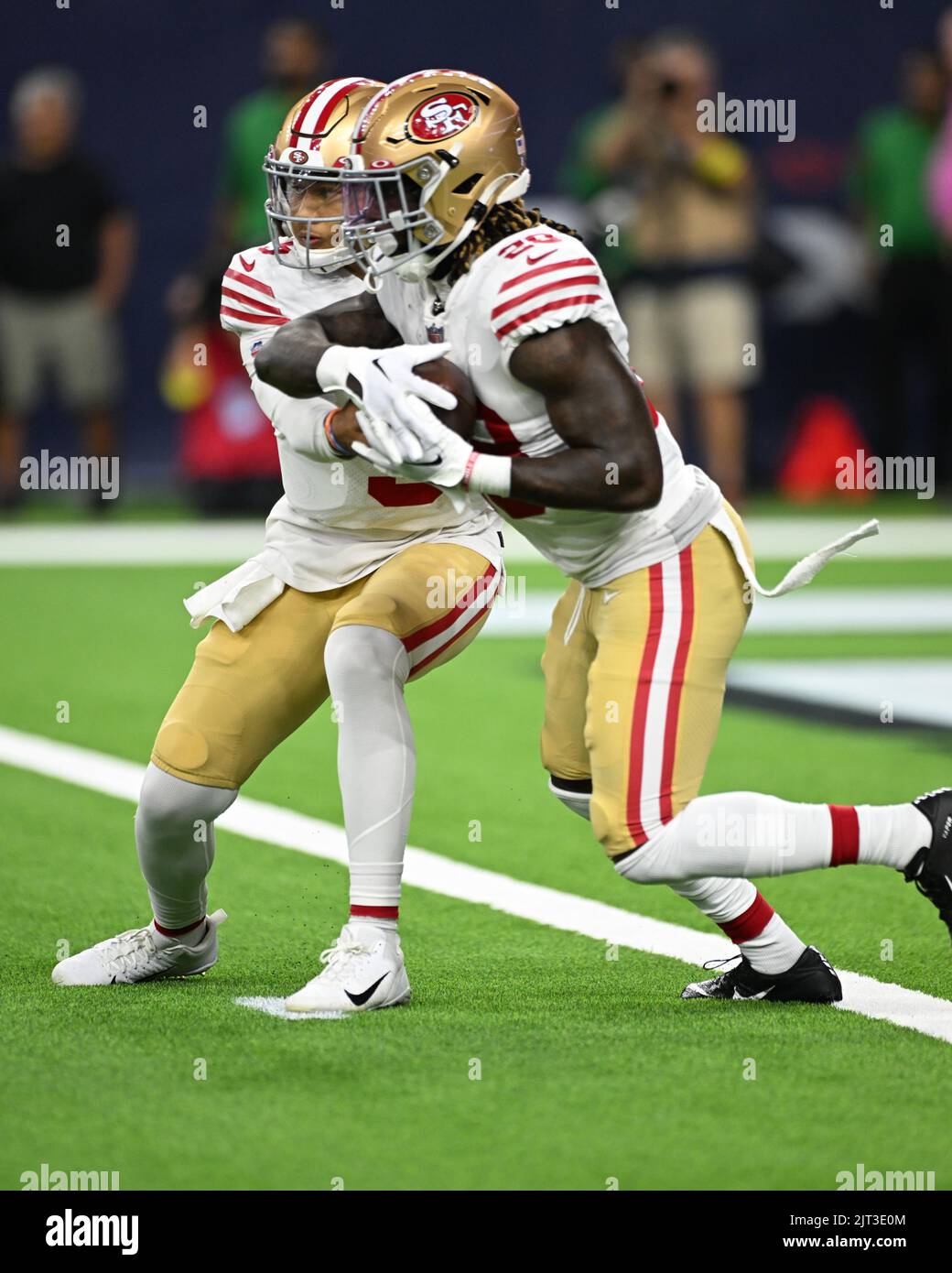 San Francisco 49ers quarterback Trey Lance (5) hands-off to San ...