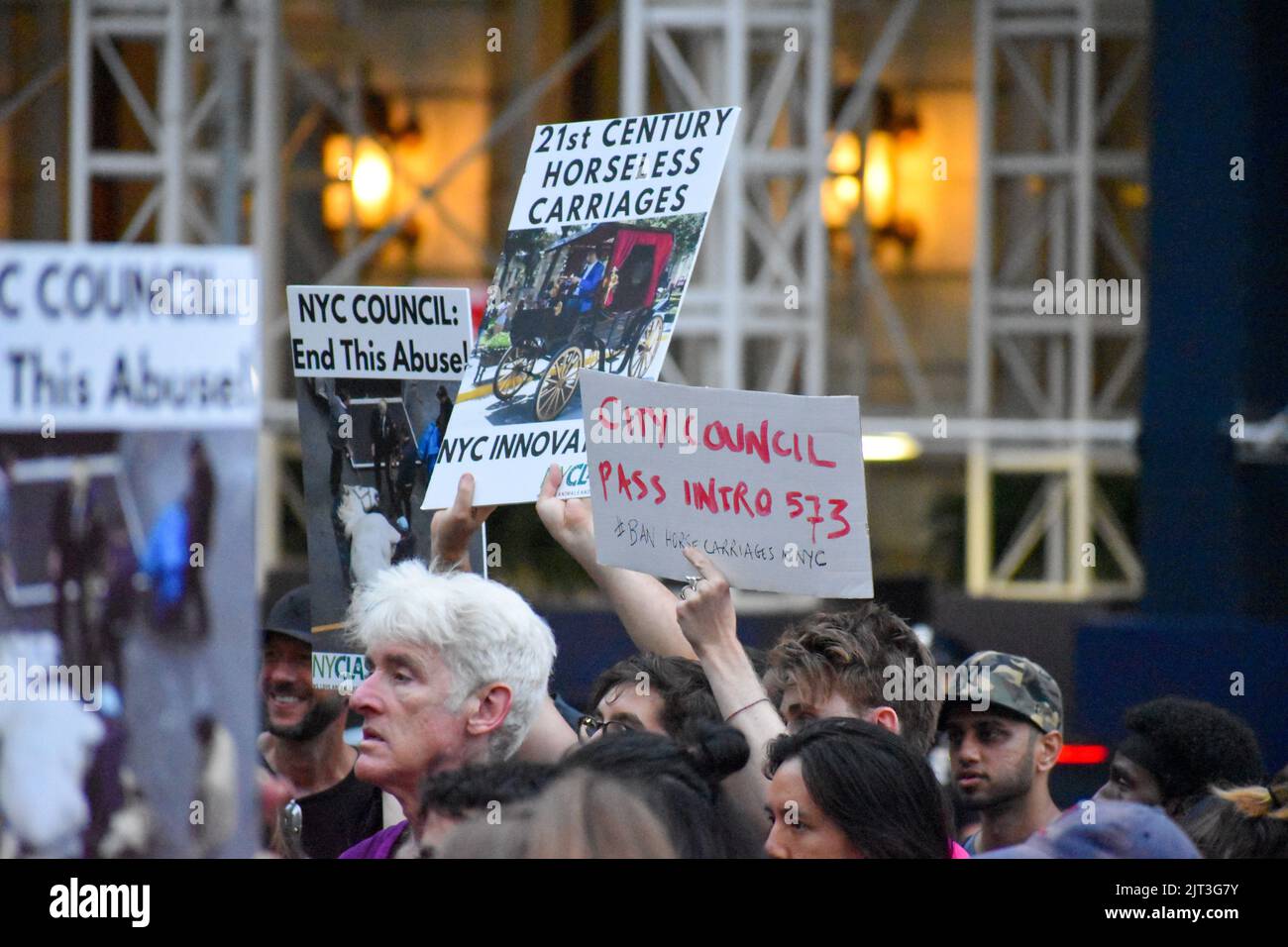 Rally participants holding animal anti-abuse signs in front of the ... Rally participants holding animal anti-abuse signs in front of the ...