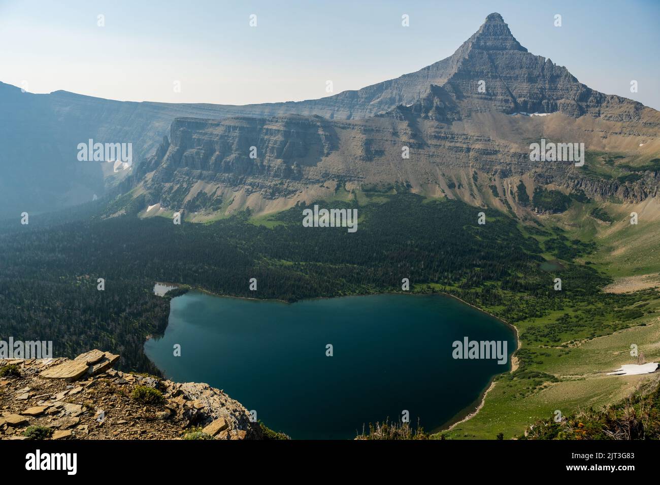 Old Man Lake Sits Below Flinsch Peak in Glacier National Park Stock ...