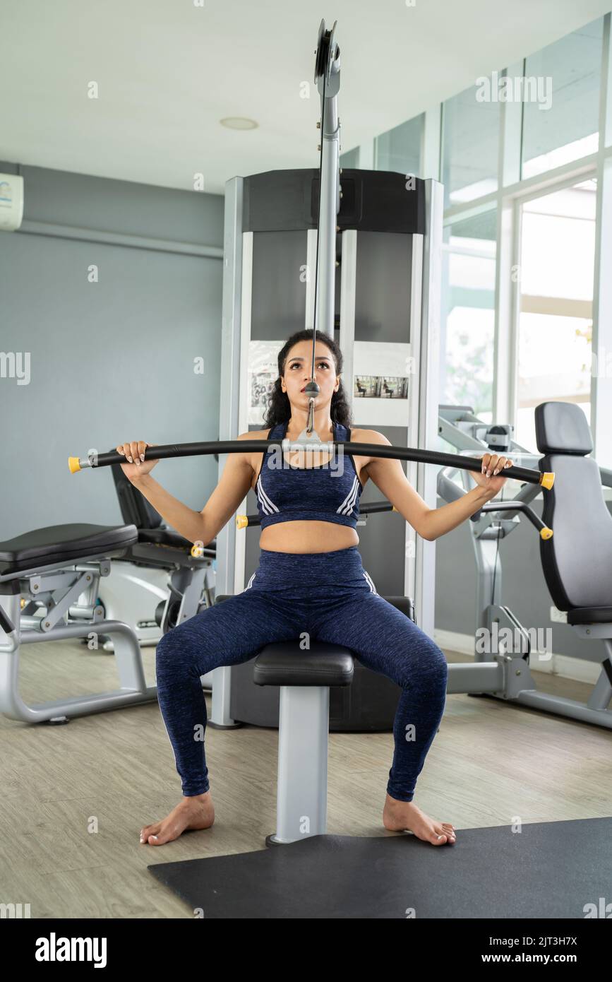 beautiful muscular fit woman exercising building muscles. Muscular ...