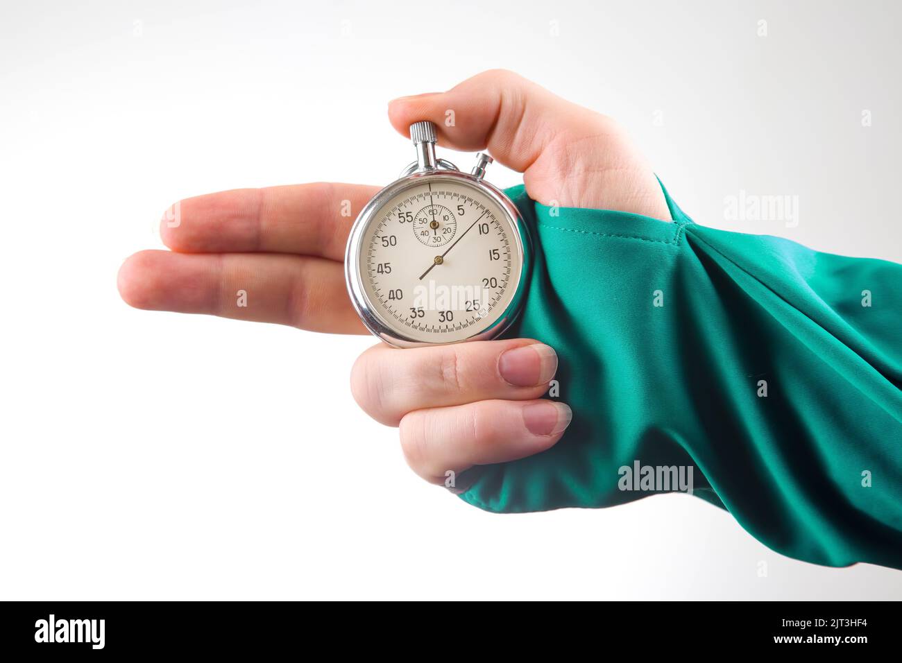hand with finger direction pointer and mechanical stopwatch on white ...