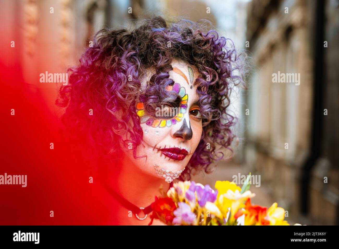 young latin caucasian woman standing in a cemetery representing La ...