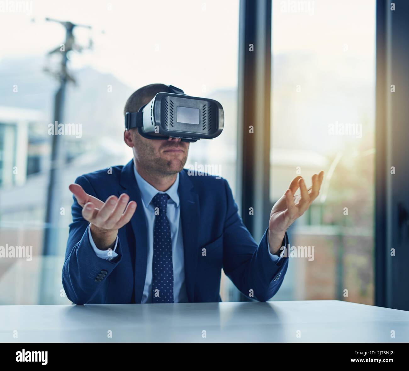 Meeting with international colleagues. businessman wearing a VR headset ...