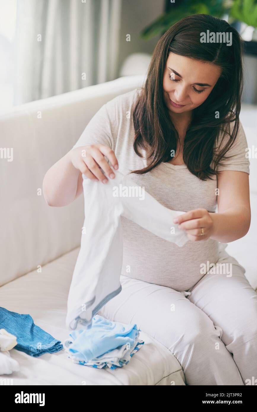 Getting everything ready before the baby comes. a pregnant woman ...