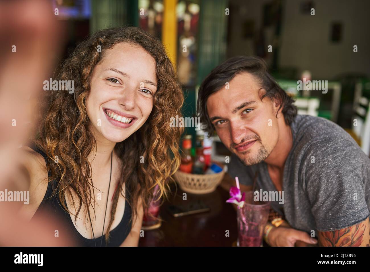 Put your selfie face on. Portrait of a happy young couple taking a ...