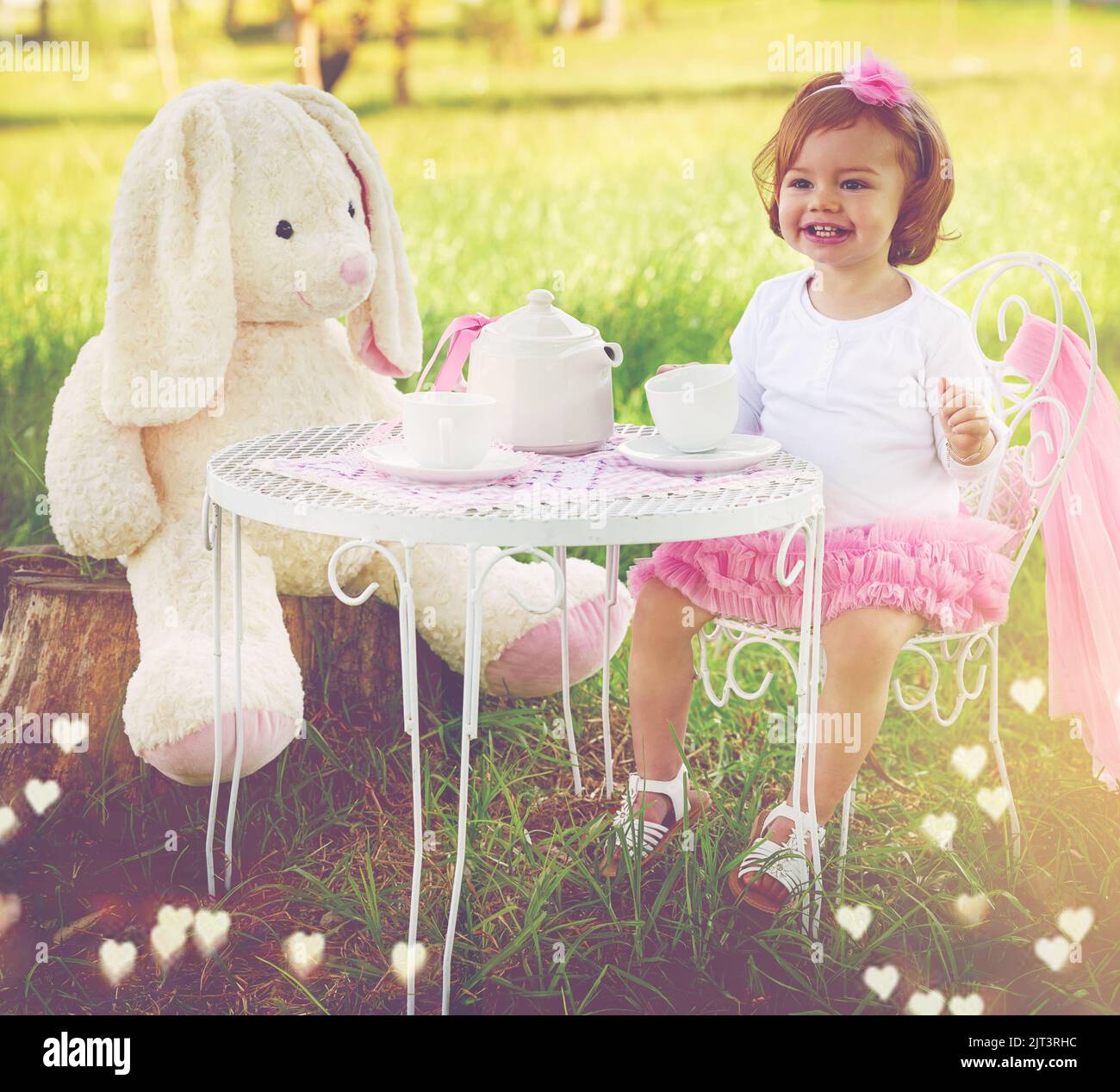 Cute as a button at tea time. a cute little girl having a tea party ...