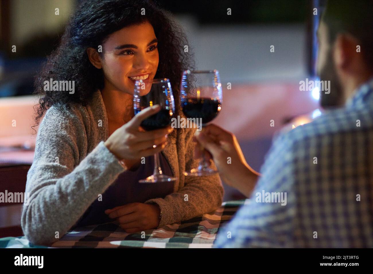 This is something worth celebrating. a young couple making a toast ...