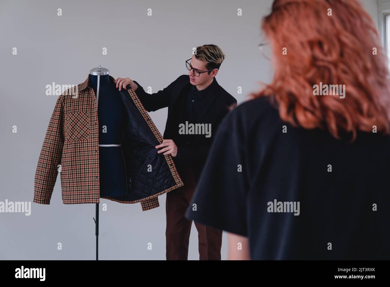 Tailor showing the suit he made. Fashion designer showing an ...