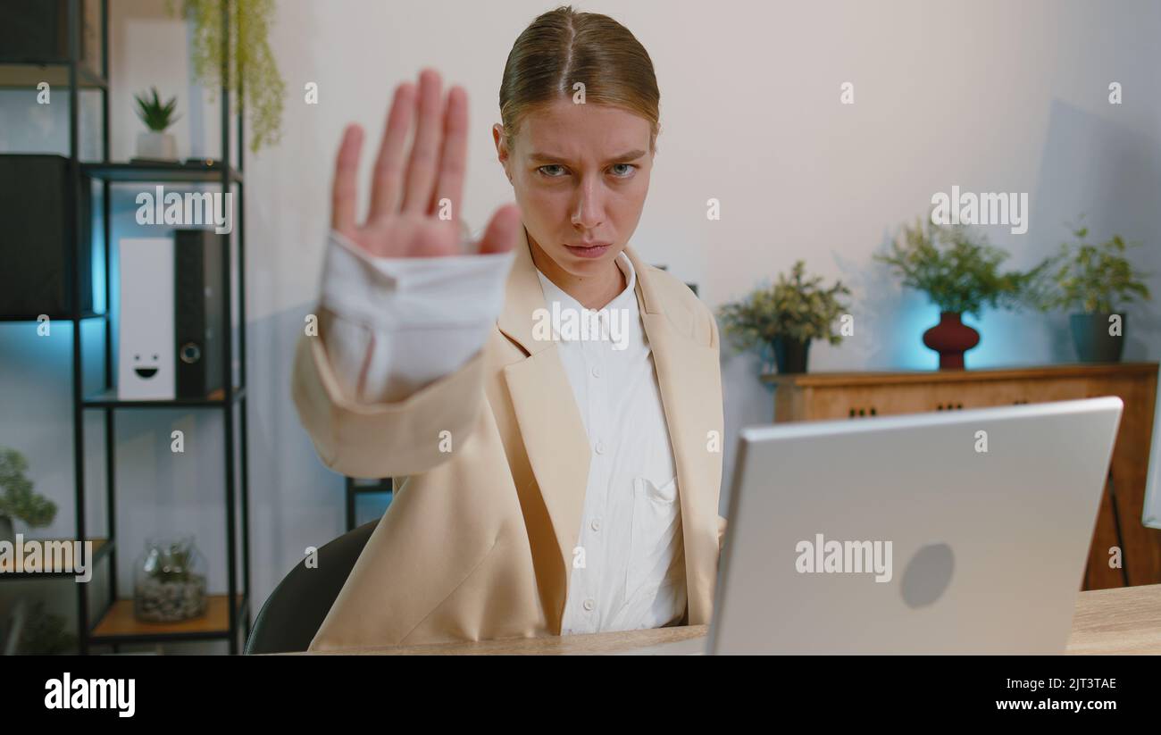 Stop gesture. Angry businesswoman girl working at office workplace ...