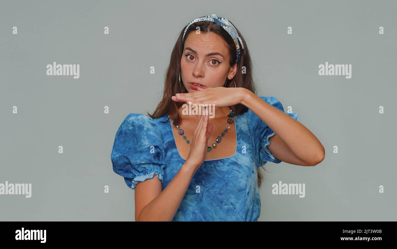 Time out, need a break. Tired serious upset pretty young woman in dress ...