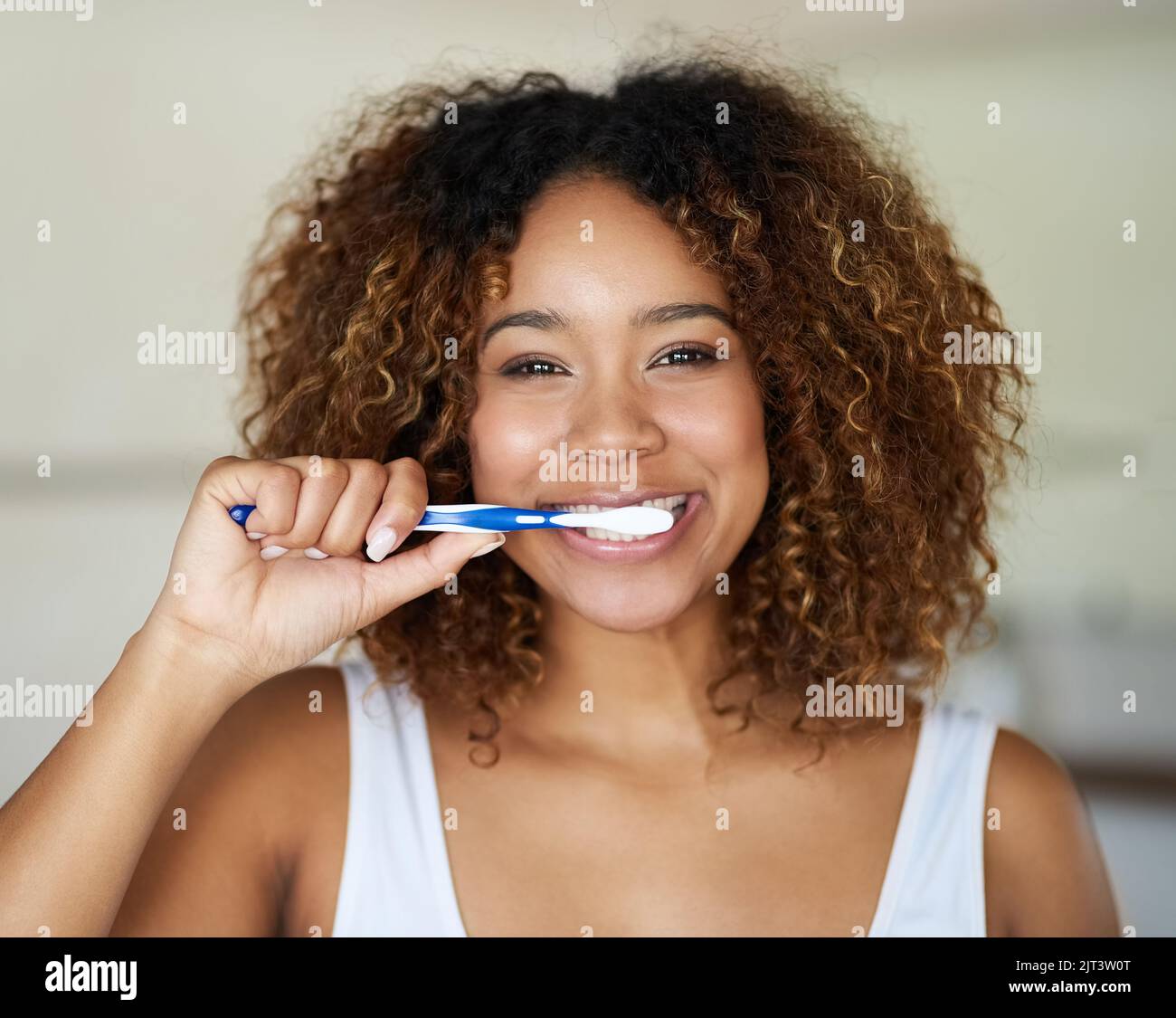 They wont be growing back this time. a young woman brushing her teeth ...