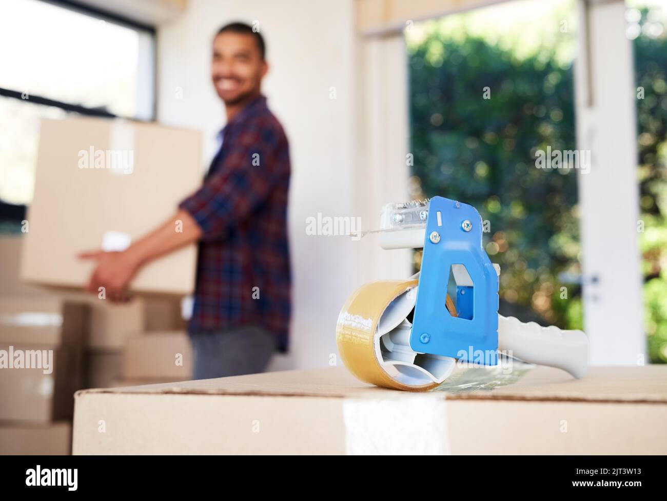 Im going to make this place my home. a young man carrying cardboard ...