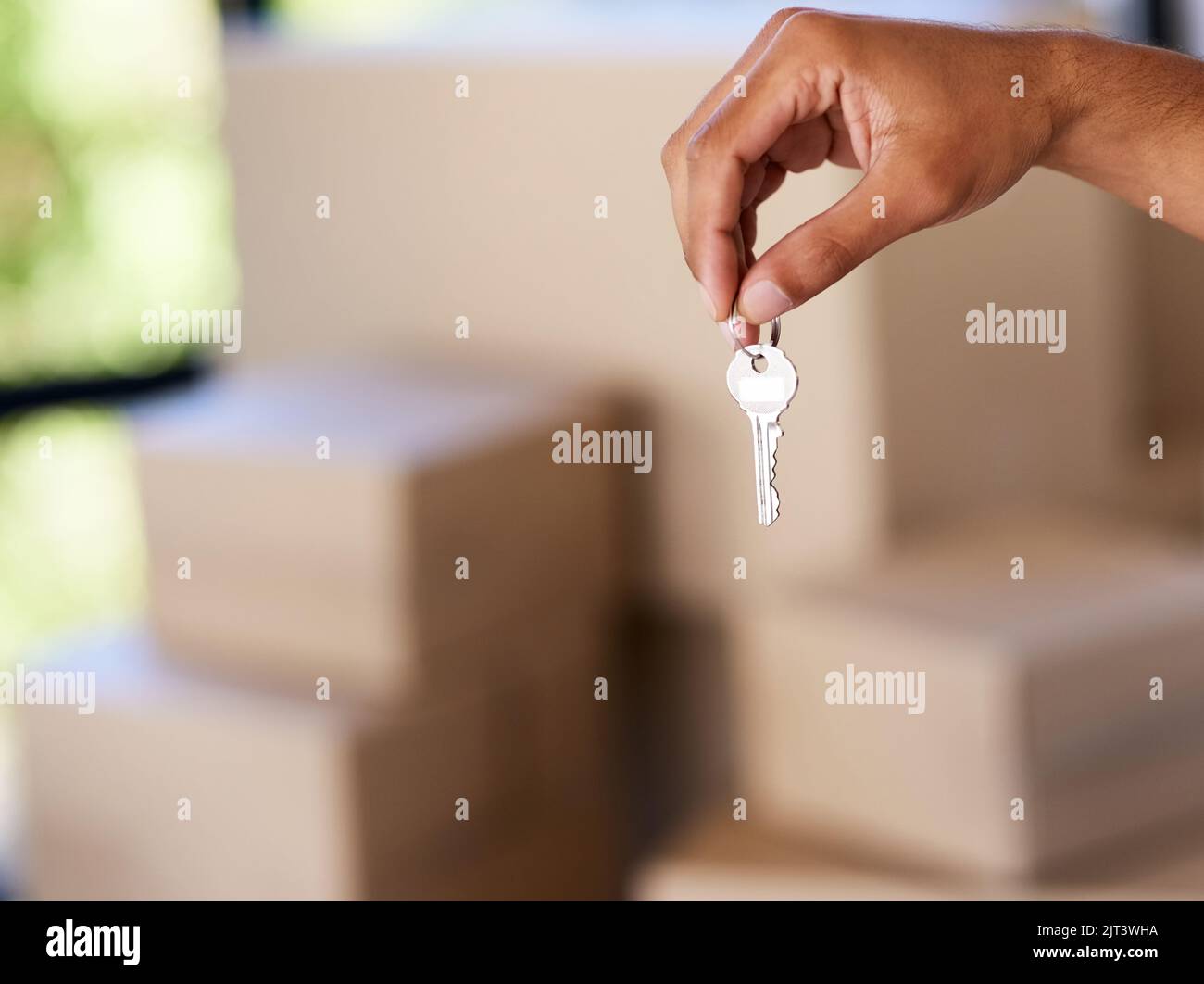 The key to his dream house. an unidentifiable man holding up his house ...