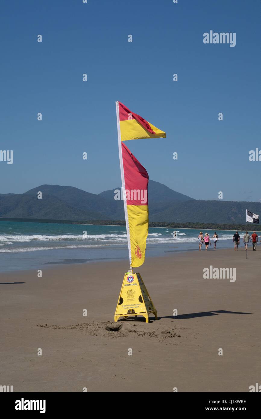 Australian lifeguard signs and red and yellow flags at Four Mile Beach ...