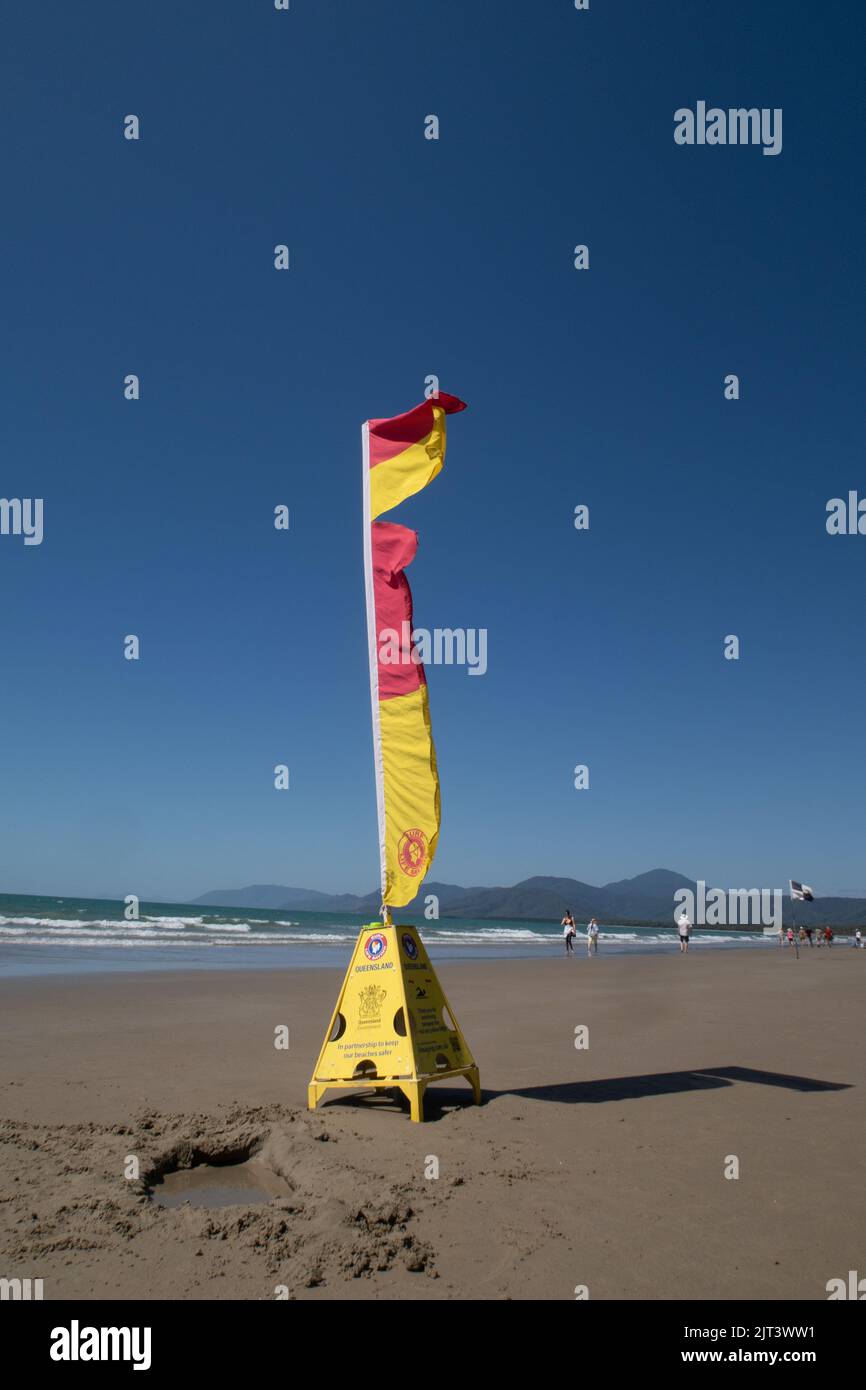 Australian lifeguard signs and red and yellow flags at Four Mile Beach ...