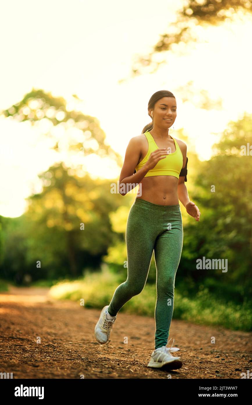 Go ahead and do something good for you. a young woman running in a ...