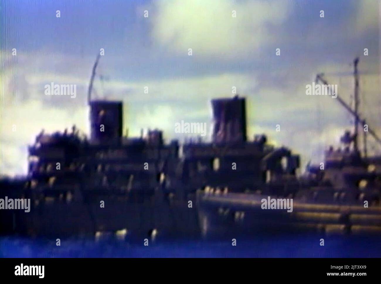 Tug alongside of USS Cortland (APA-75) at Bikini Atoll, circa 8 July ...